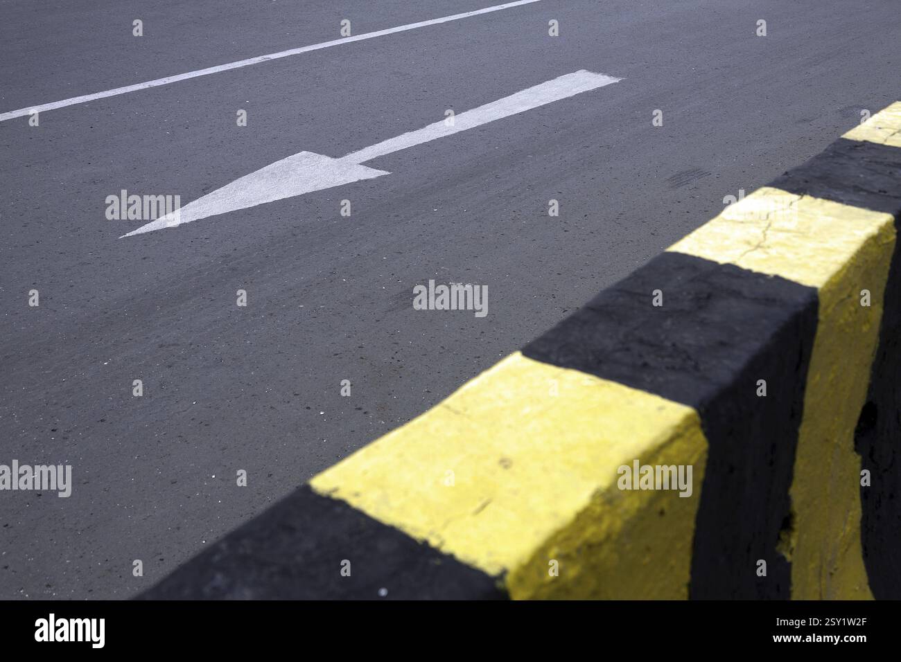 Arrow traffic sign on the road and Divider Mumbai Maharashtra India ...