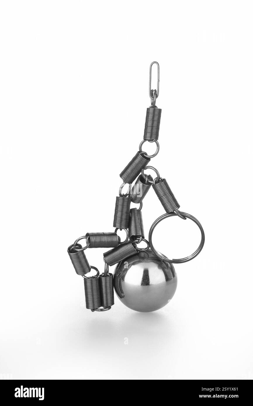 Balancing of ball ring and spring, india, asia Stock Photo - Alamy
