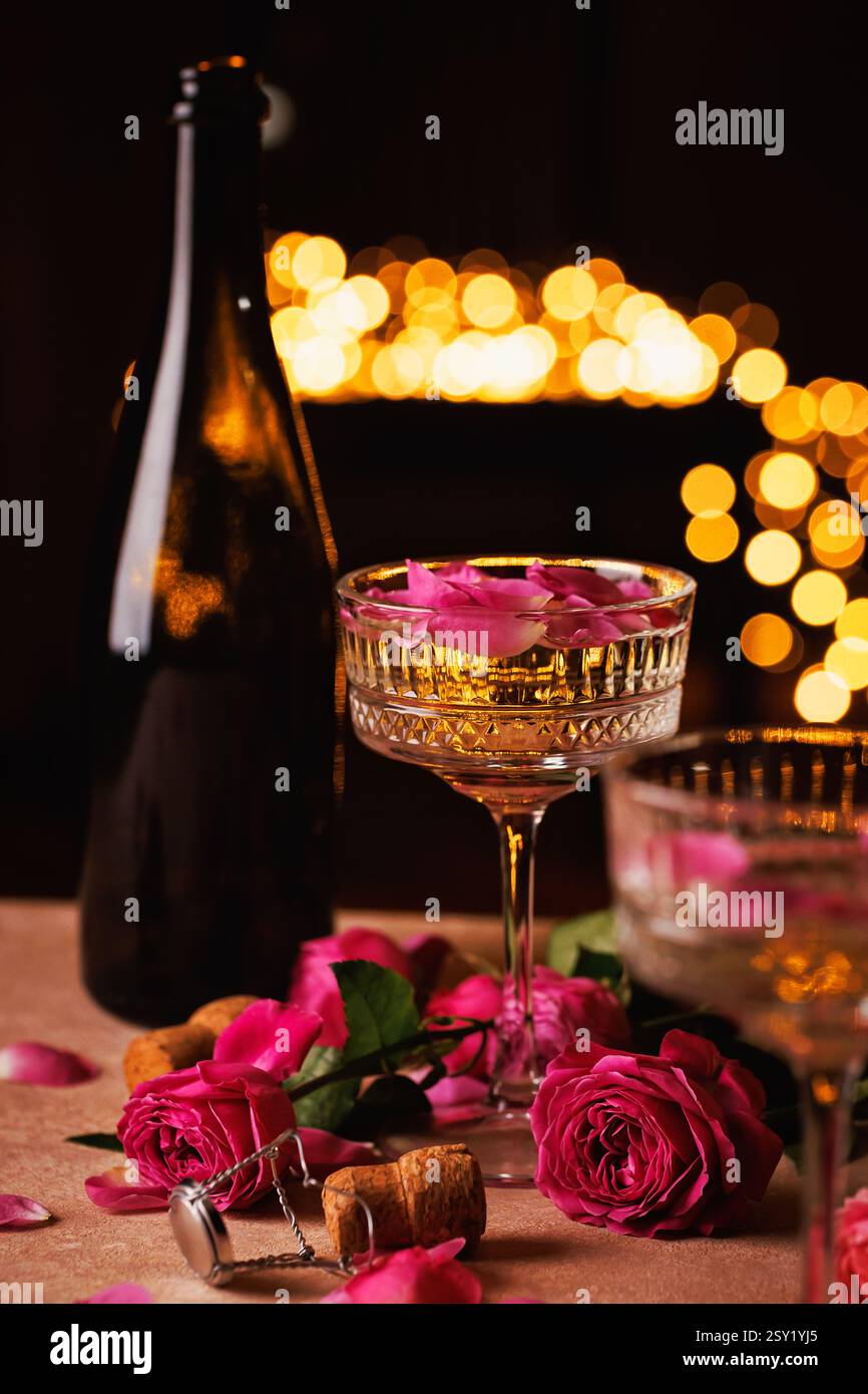 Romantic champagne celebration with roses and candlelight Stock Photo ...