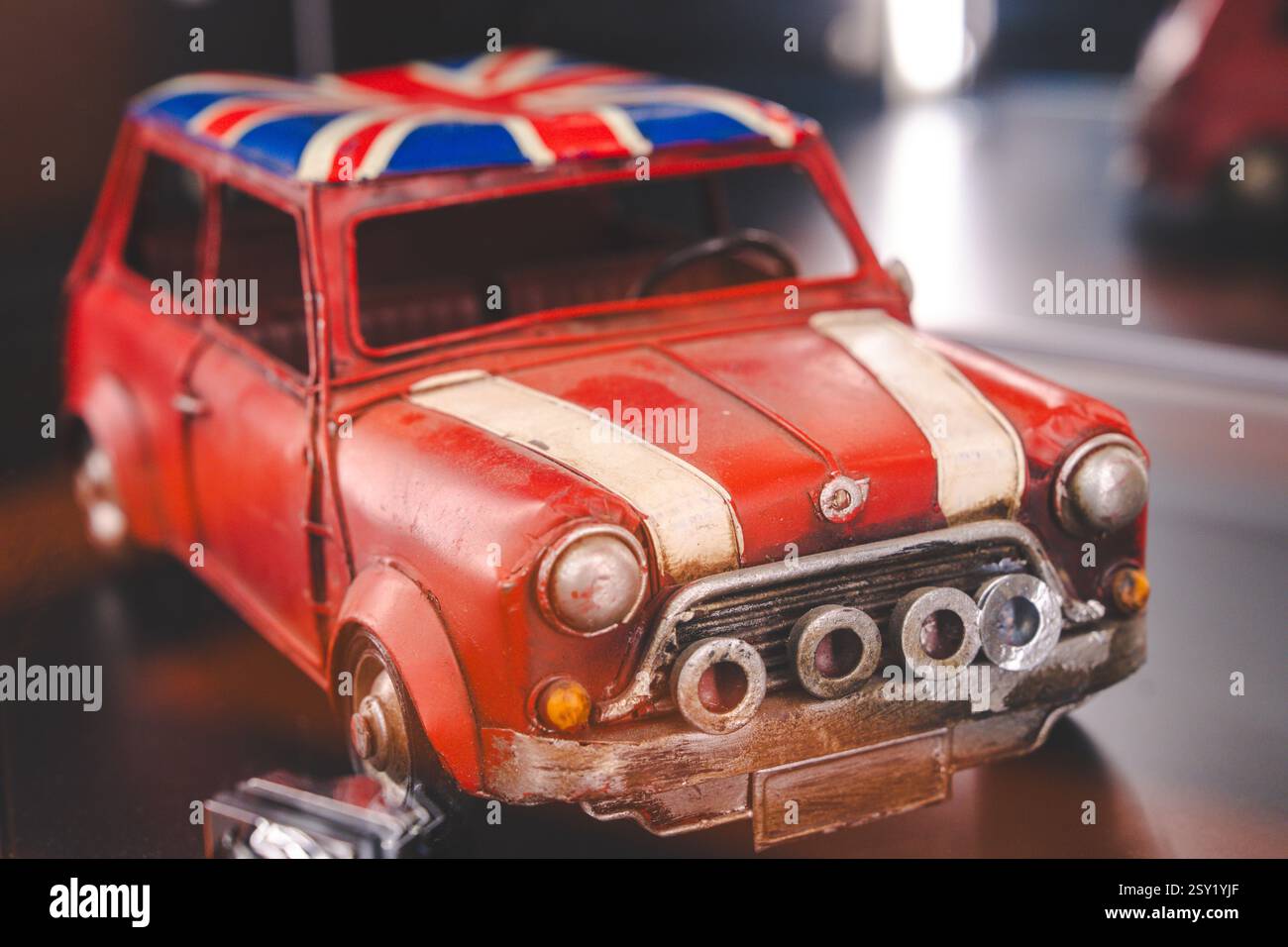 Classic red mini car model showcasing British design with a union jack ...