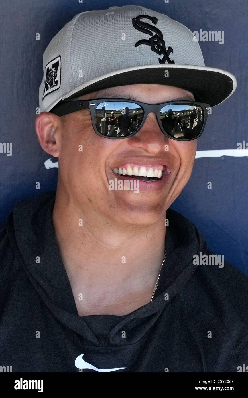 Chicago White Sox manager Will Venable smiles in the dugout prior to a ...