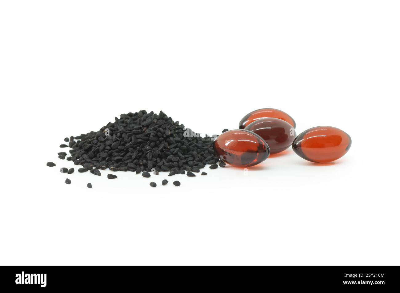 Pills of black cumin seeds essential oil isolated on white background ...