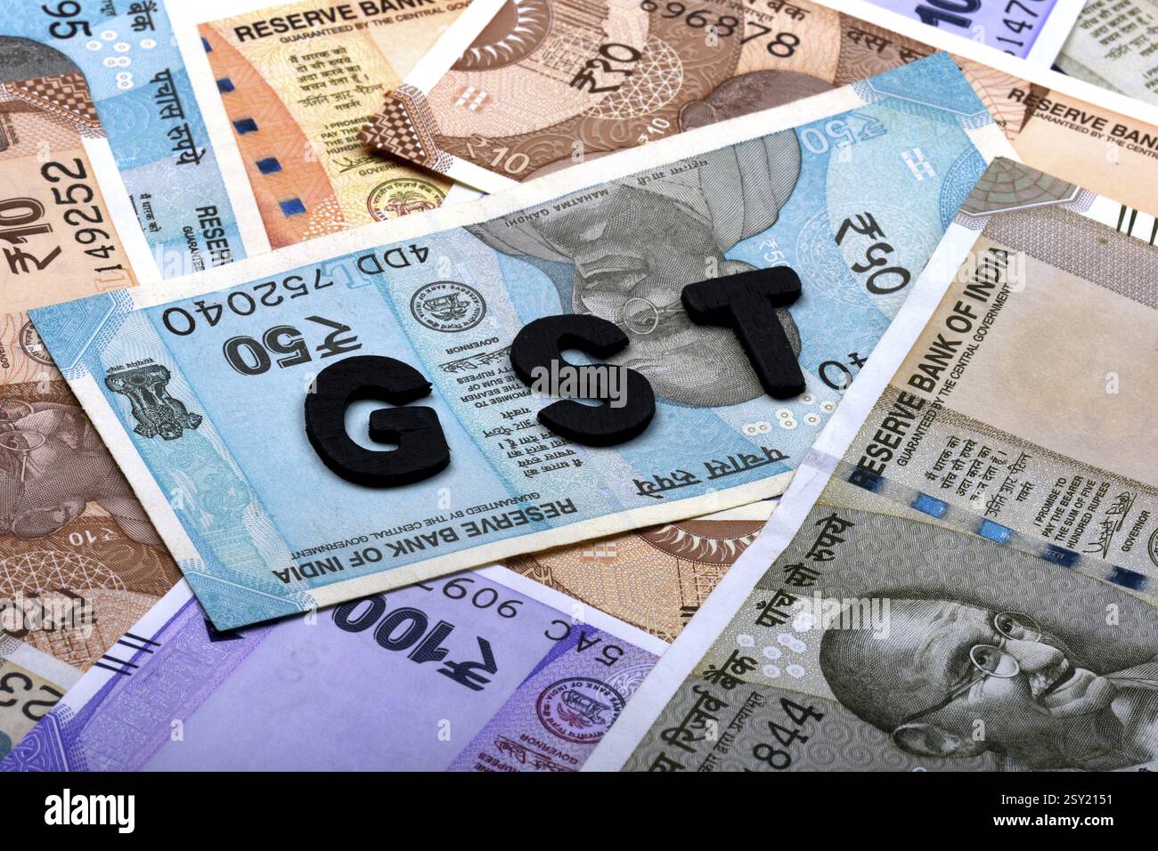 GST concept, GST alphabet on money background, business and financial ...