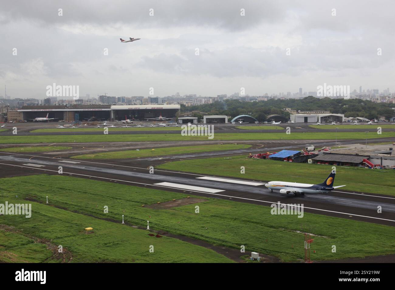 Plane taxing at mumbai airport Stock Photo - Alamy