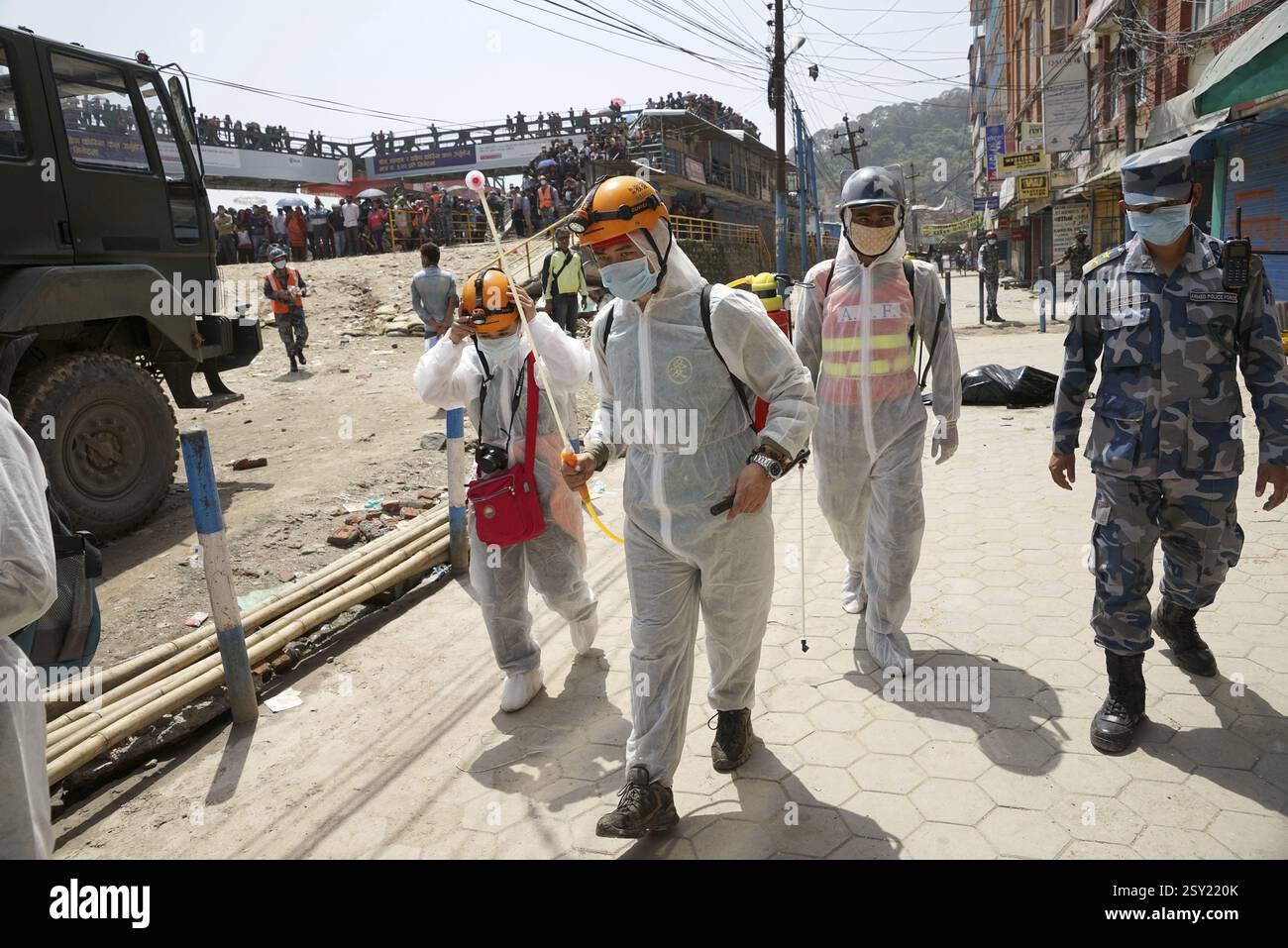 Rescue personnel spray disinfectant, earthquake, nepal, asia Stock ...