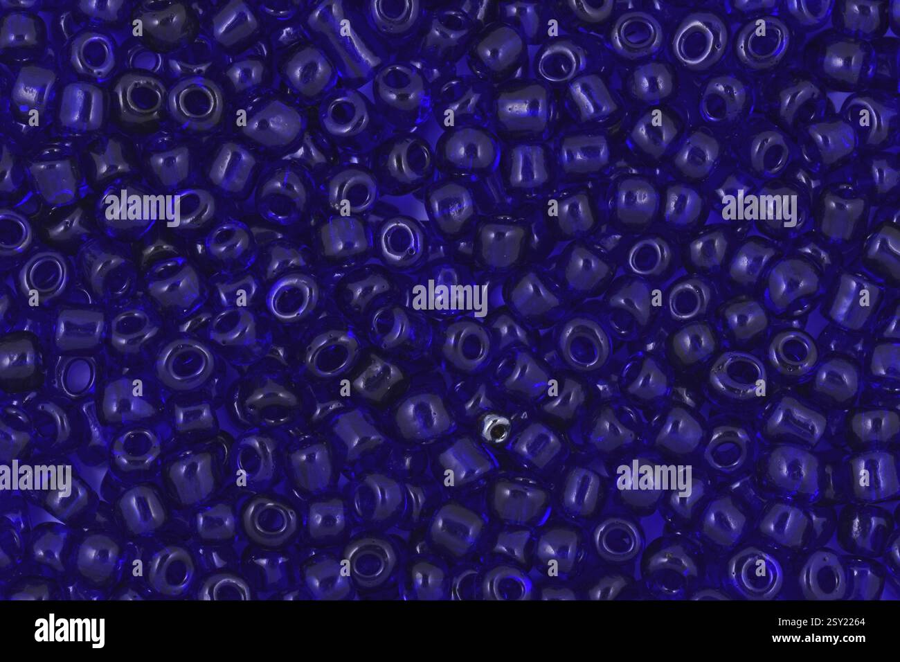 Blue Glass Seed Bead Background, Transparent beads on the white ...