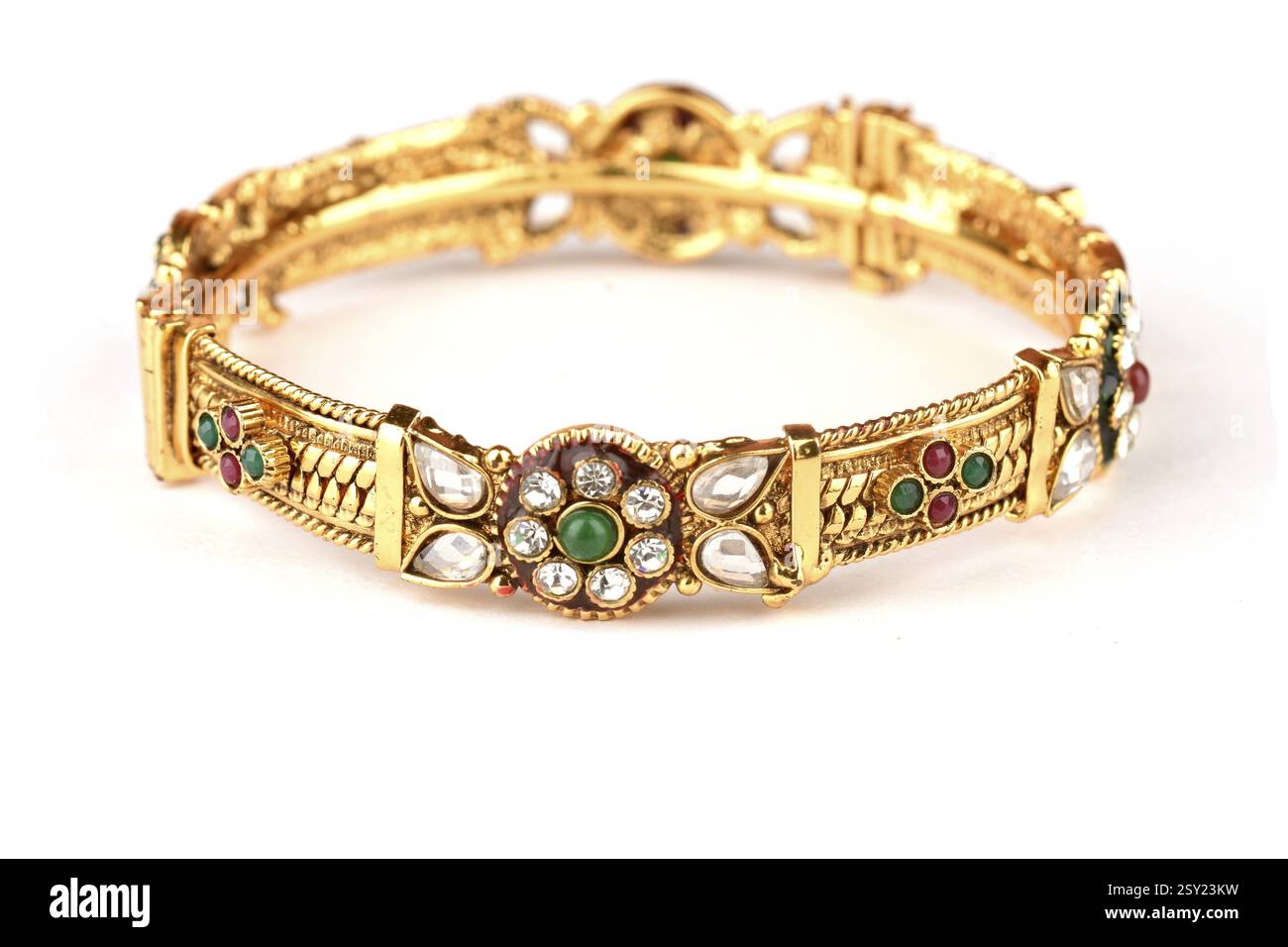 Indian golden Bangles. Bracelet with diamonds and stones on a white ...