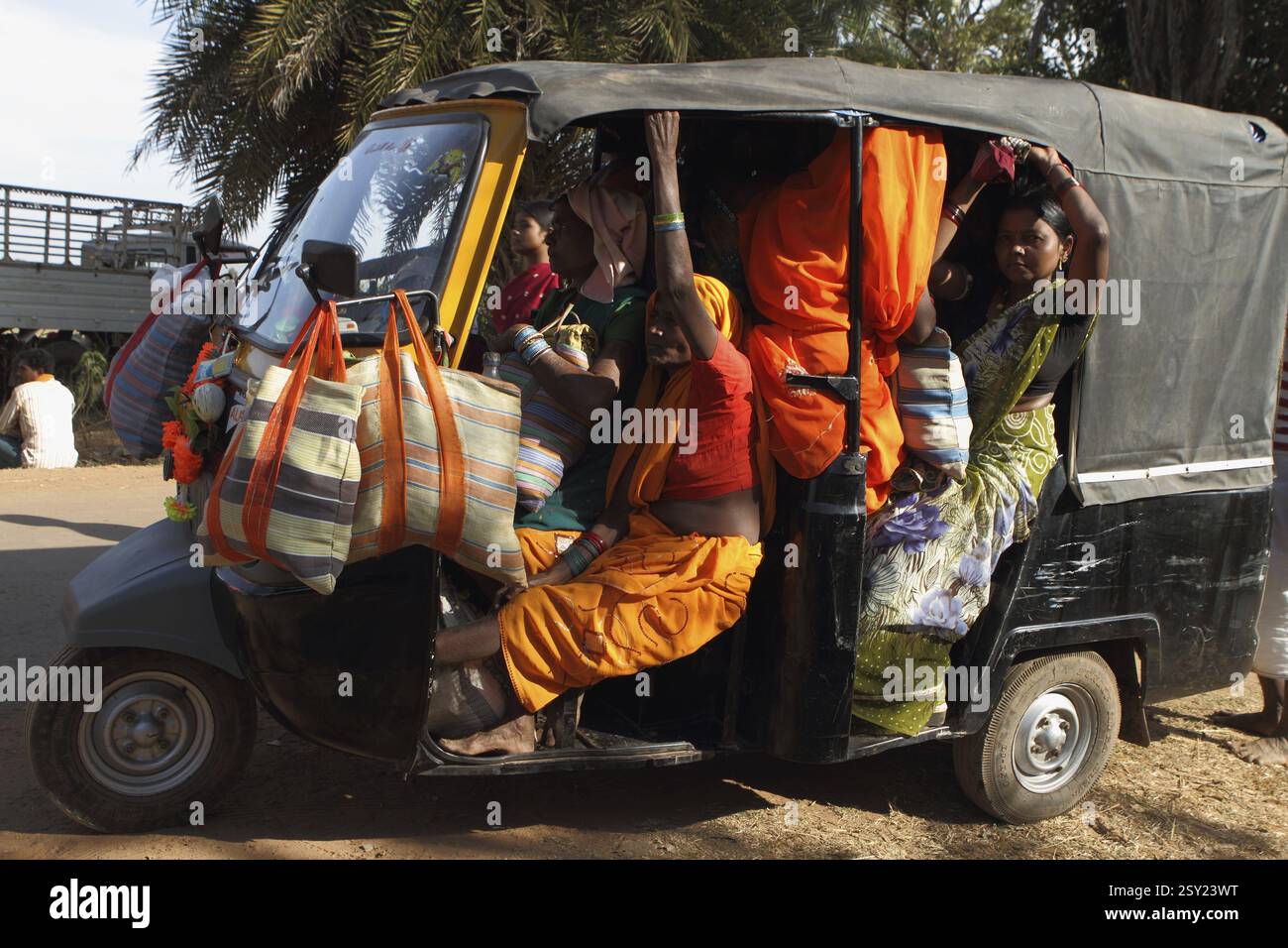 People sitting in rickshaw, haat market, bastar, chhattisgarh, india ...