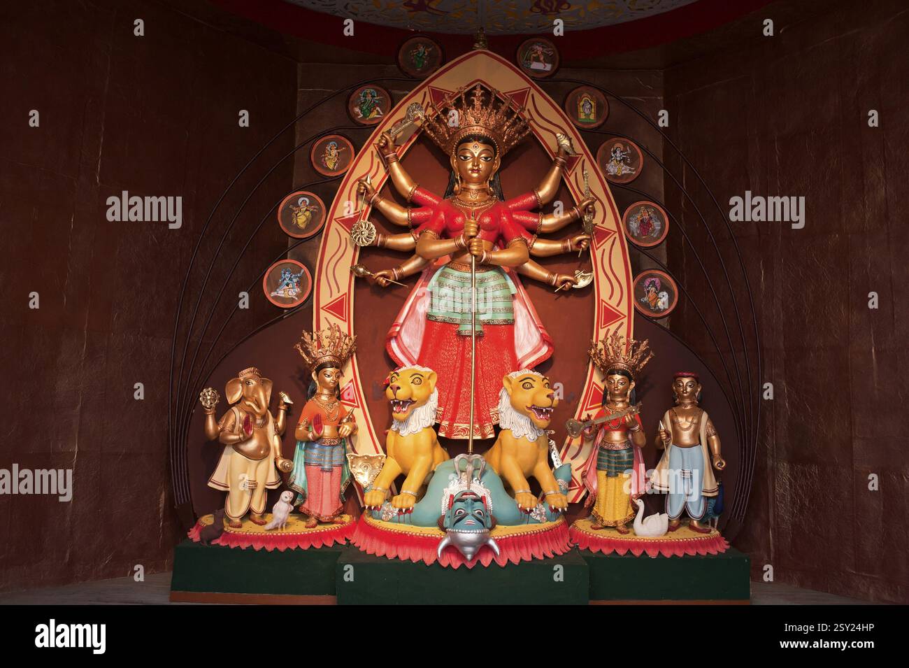 Goddess durga killing demon mahishasura with goddesses laxmi saraswati ...
