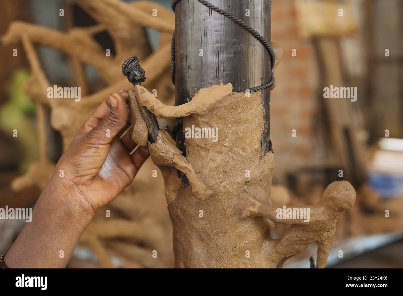 Wax model of human figure being covered with clay, bastar, chhattisgarh ...