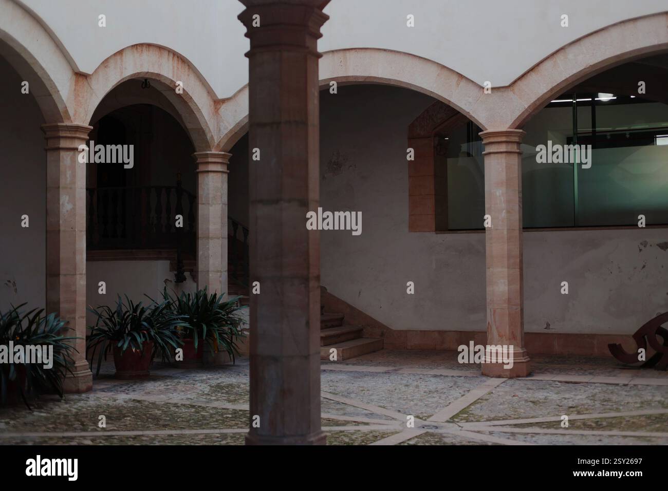 stone courtyard columns in the shade play of light and shadow ancient ...
