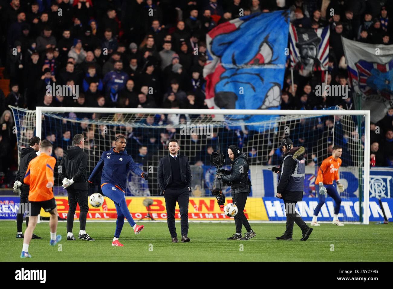 Rangers interim head coach Barry Ferguson (centre left) walks the pitch ...