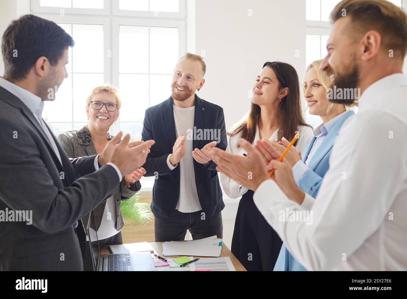Team Celebration and Recognition in a Modern Office Setting During a ...