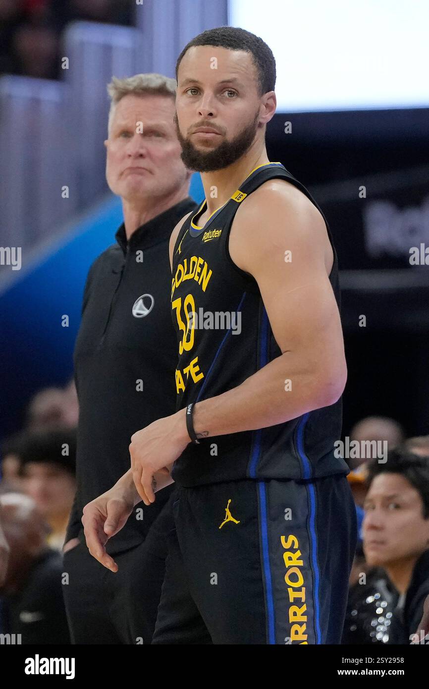 Golden State Warriors head coach Steve Kerr, left, and guard Stephen ...