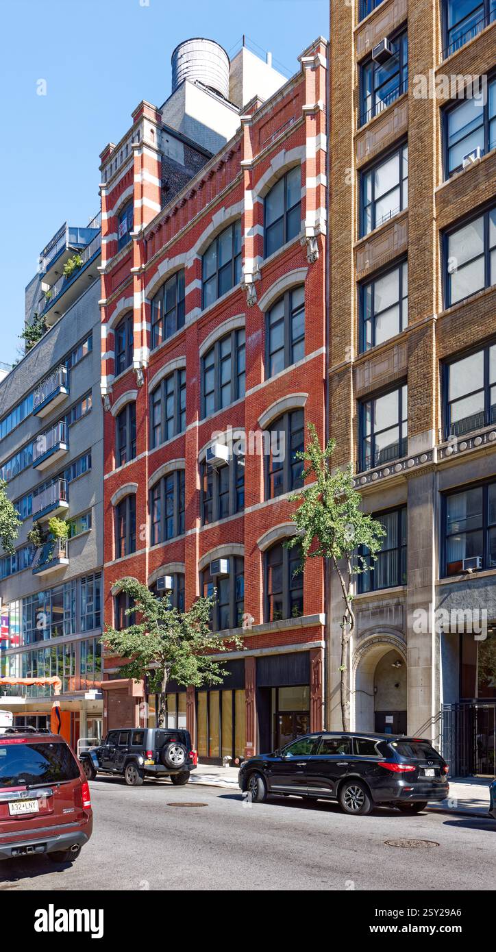 211 West 19th Street is a red brick loft building with stone accents ...