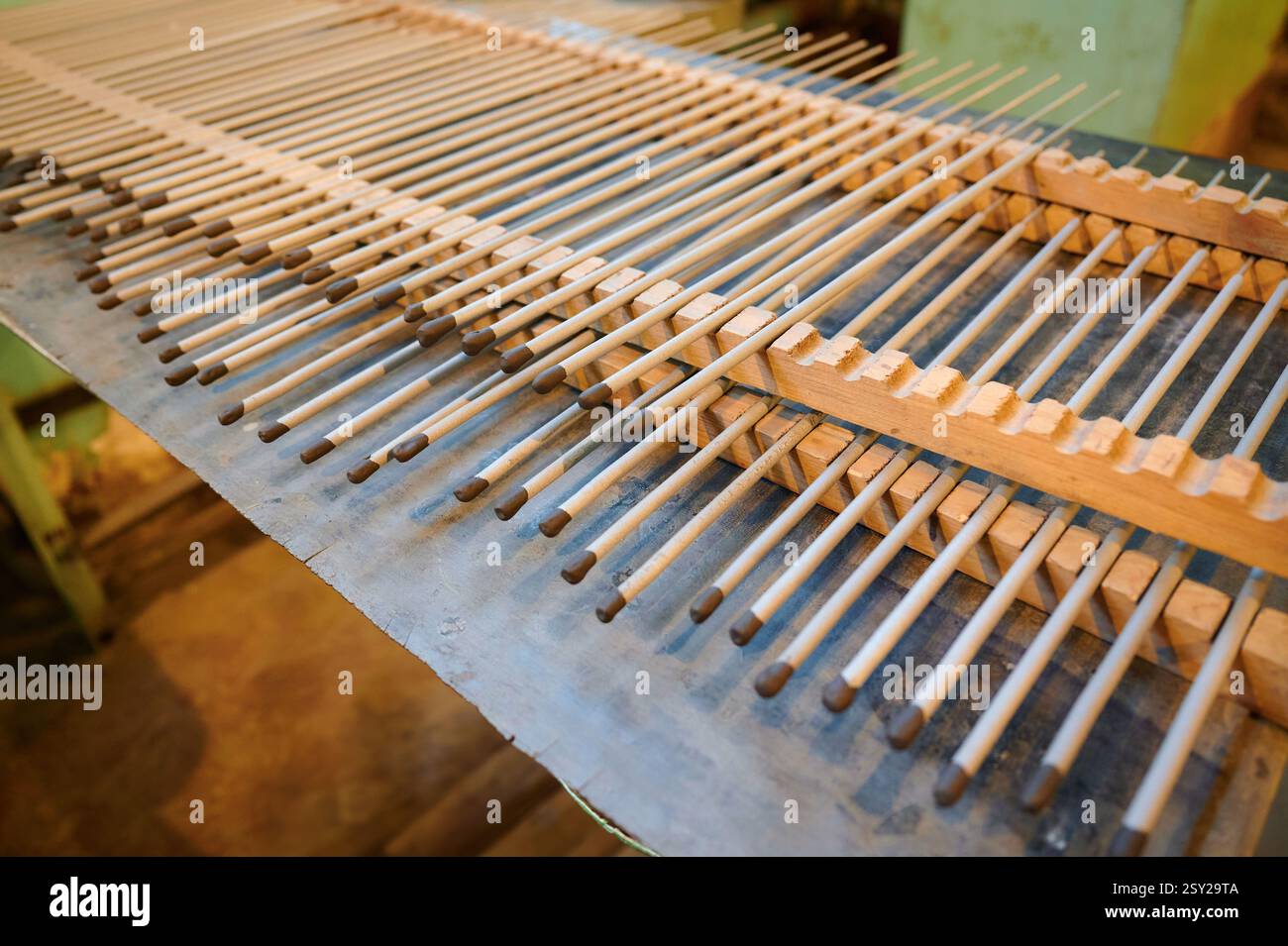 Crafting fine Bengal candles in the heart of a bustling factory, where ...