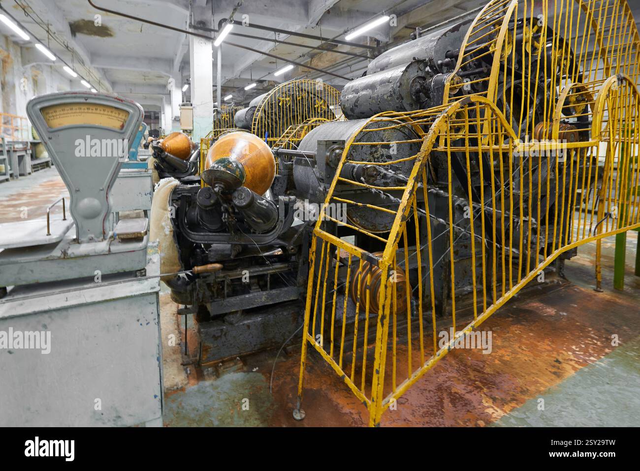 Exploring the intricate machinery of a vintage carding system in a ...
