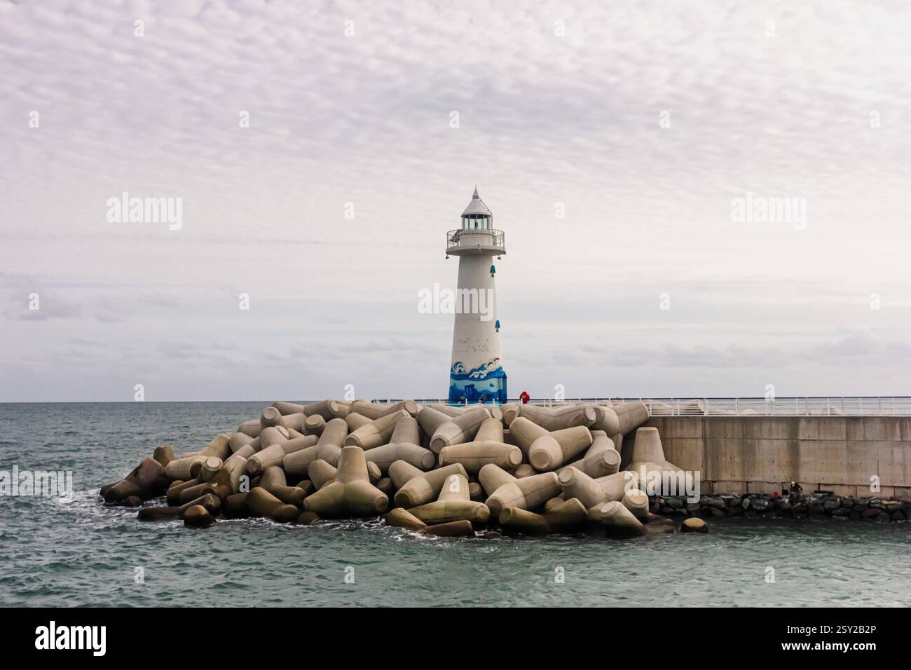 A view of a lighthouse on the coast of Busan, standing against the ...