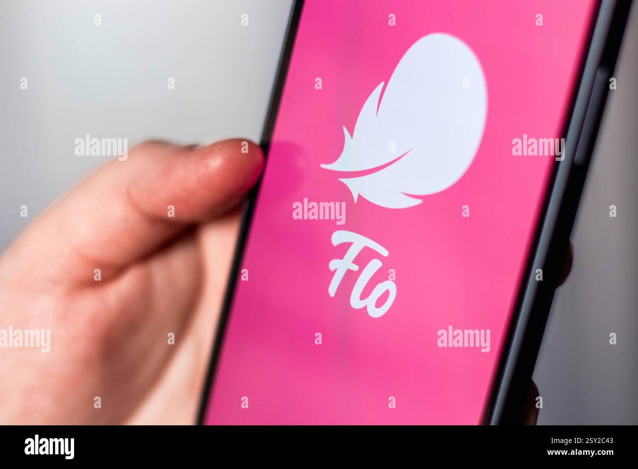 Kaliningrad, Russia 14.01.25 - Woman holding smartphone with FLO ...