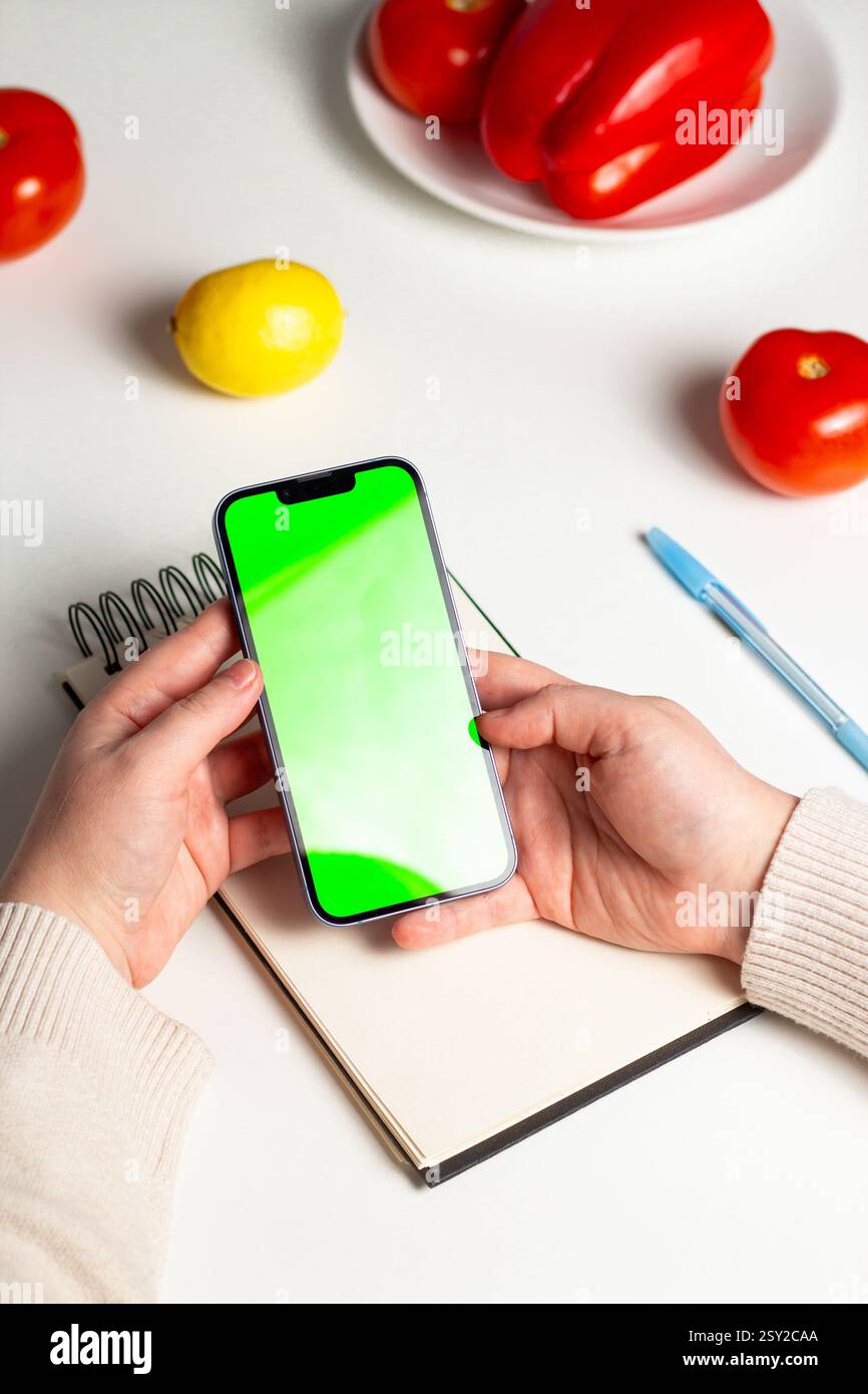 Planning Healthy Menu Concept Smartphone With Green Screen In Hands Calculating Calories