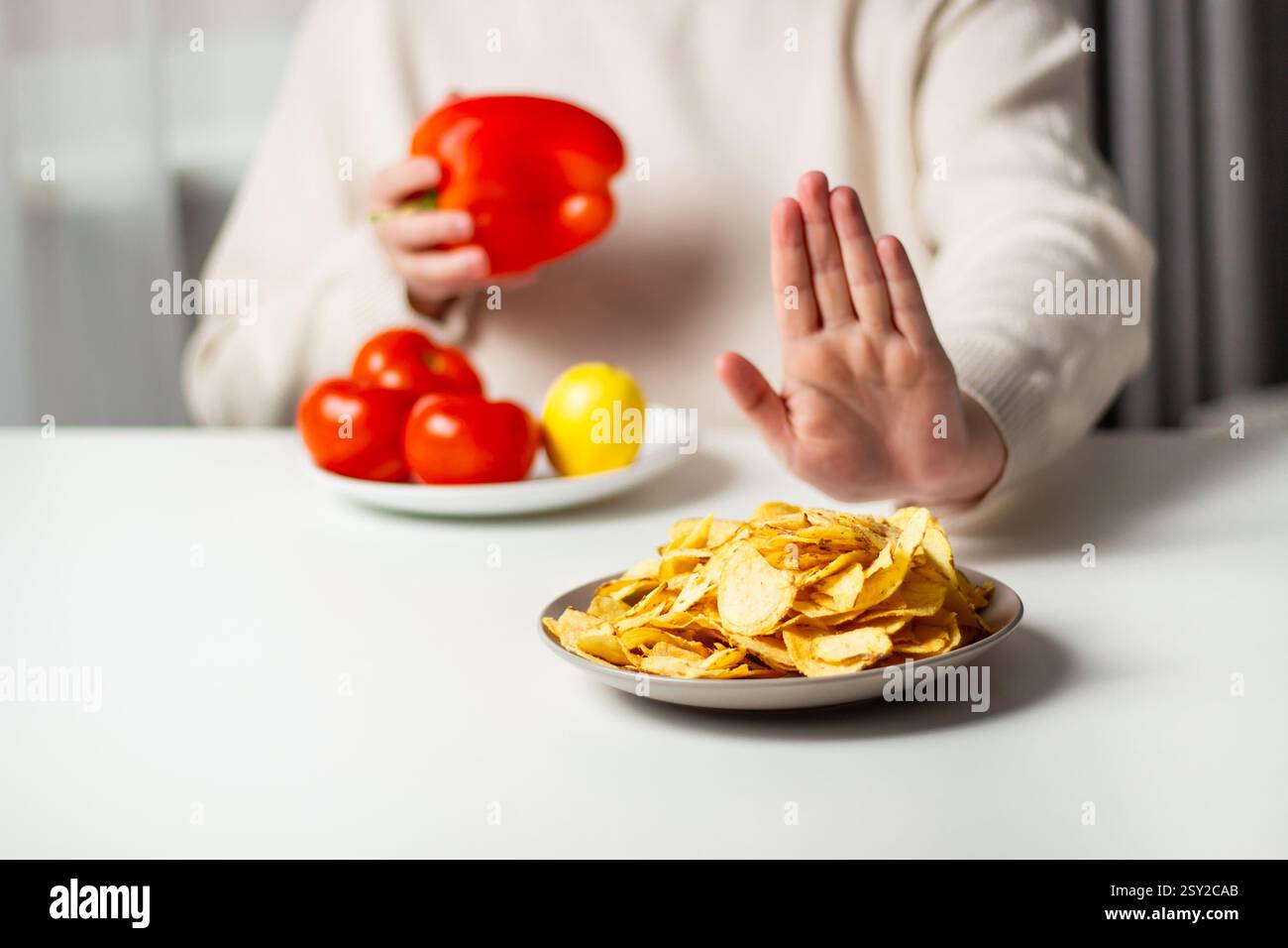 Woman pushing away plate with fried chips. No to fast food. Healthy ...