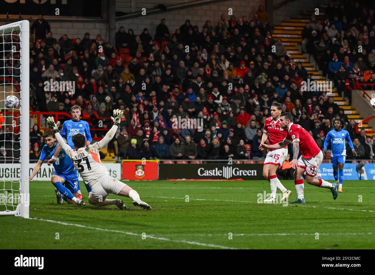 George Dobson of Wrexham scores to make it 2-0 during the The Vertu ...