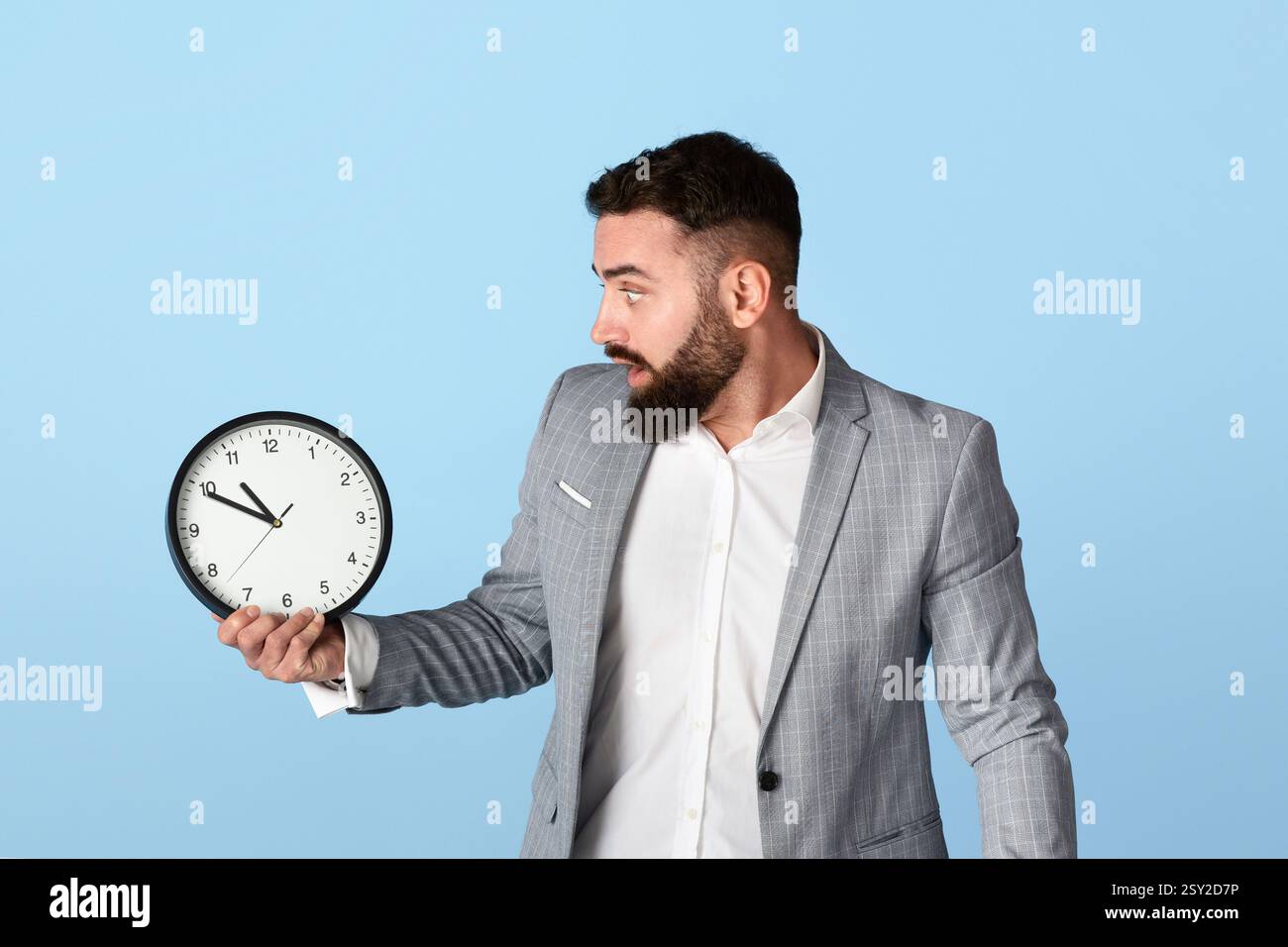 Time management problem. Scared corporate worker with analog clock ...