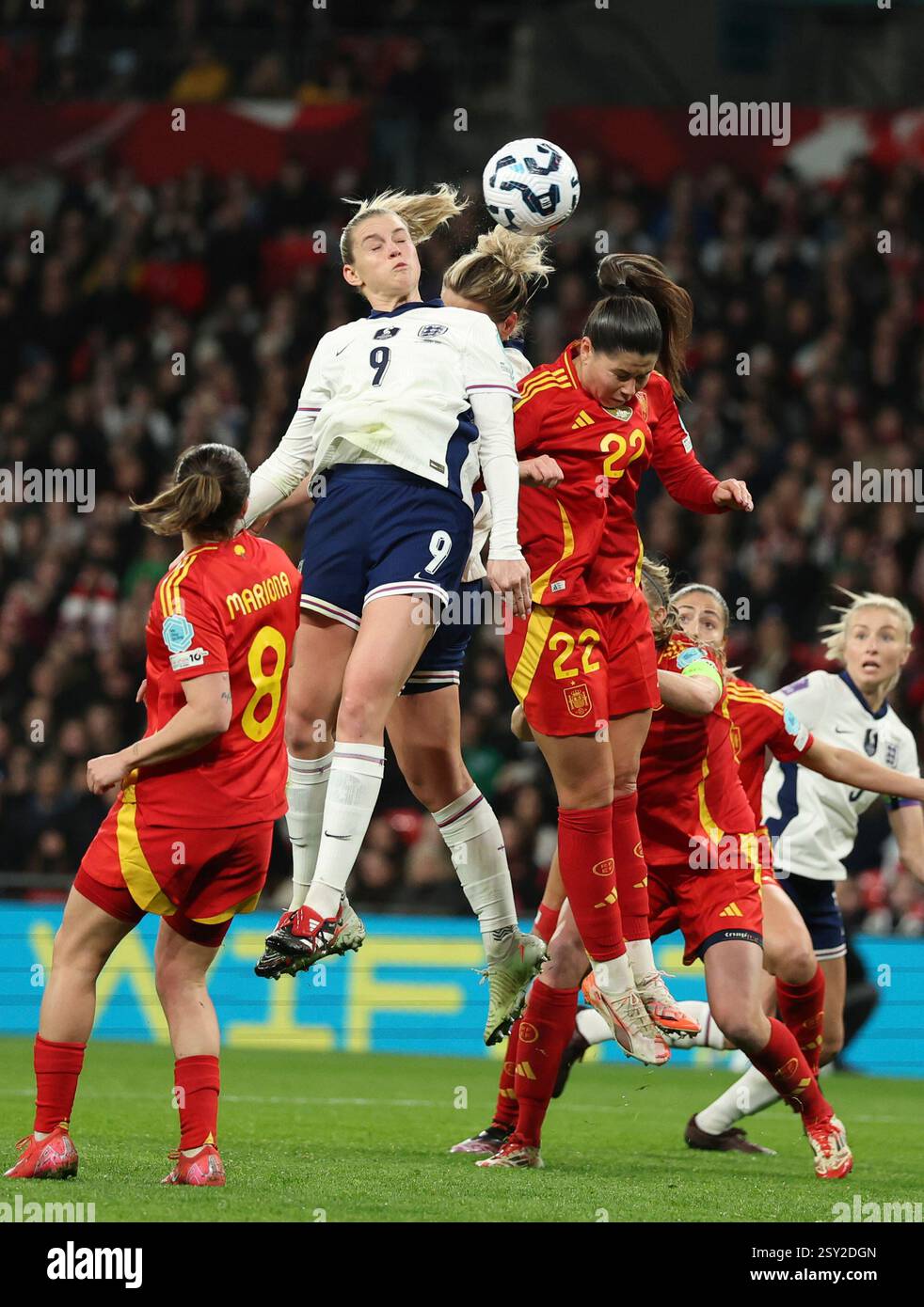 England's Alessia Russo, top left, jumps for the ball with Spain's ...