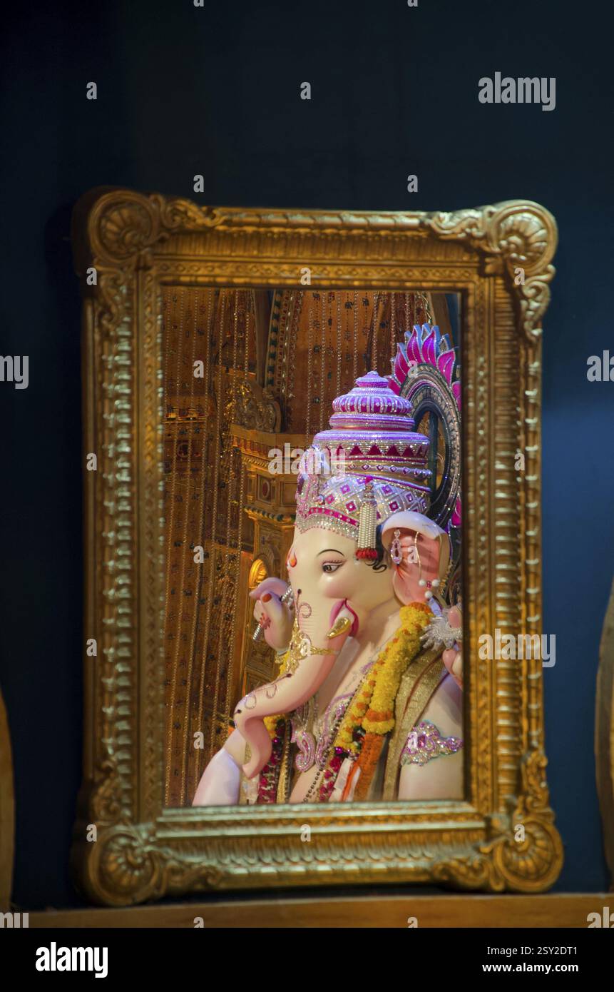 Portrait Size Reflection of an Idol of Ganesha in Mirror in a pandal ...