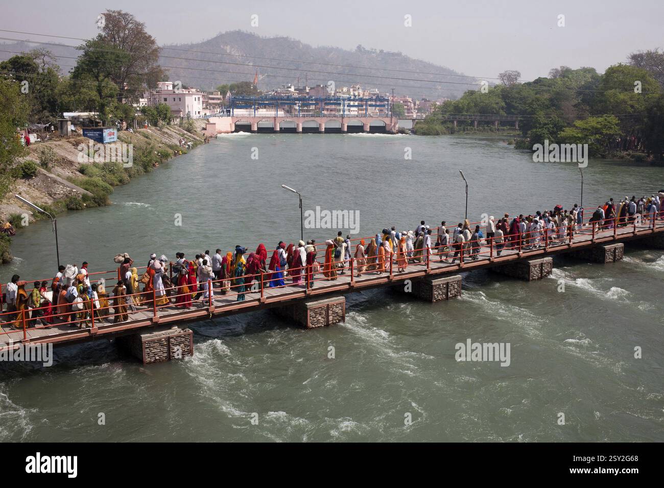 Devotees crossing bridge Ganga river Haridwar Uttarakhand India Asia ...