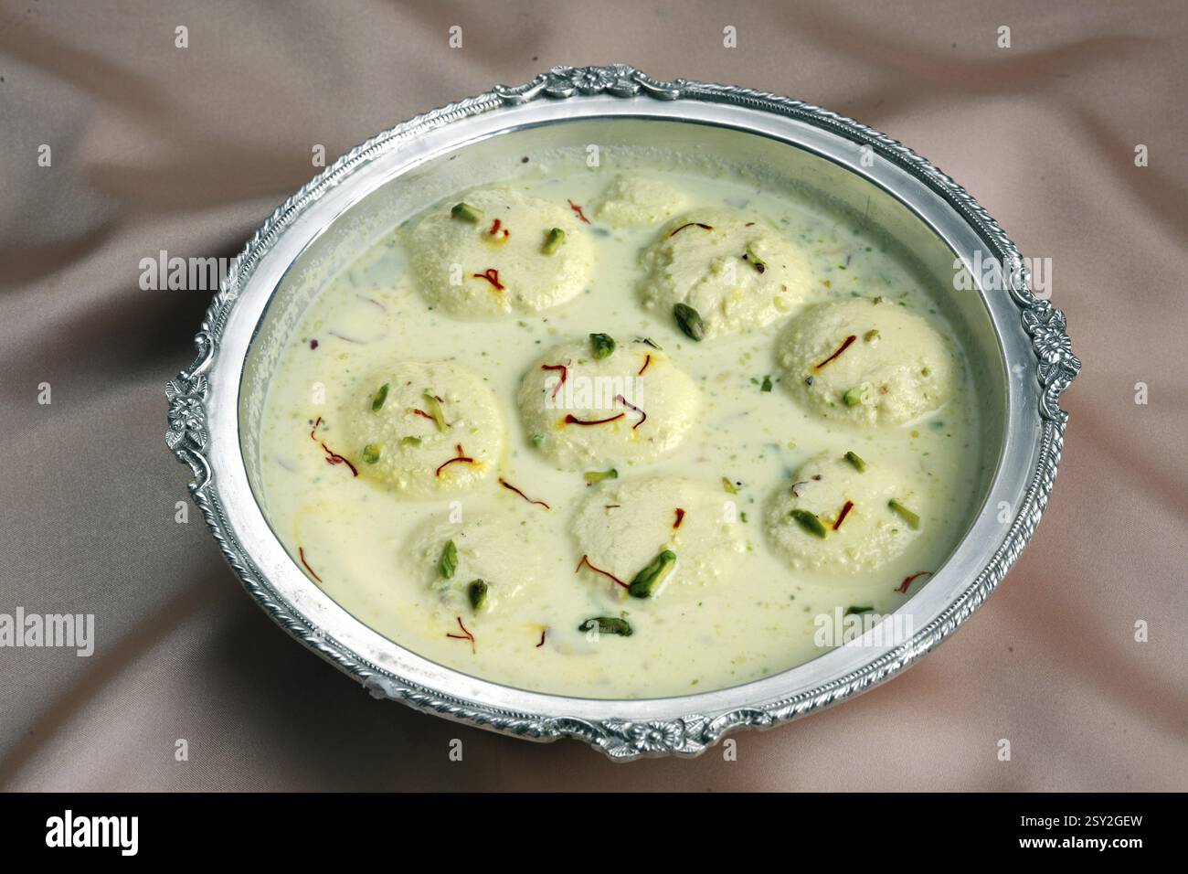Bengali Sweet Ras Malai in Silver bowl India PR#743AH Stock Photo - Alamy