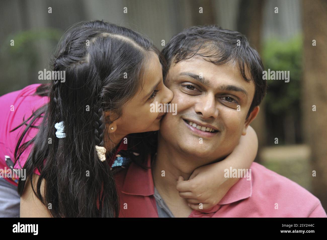 Indian father kissing daughter hi-res stock photography and images - Alamy