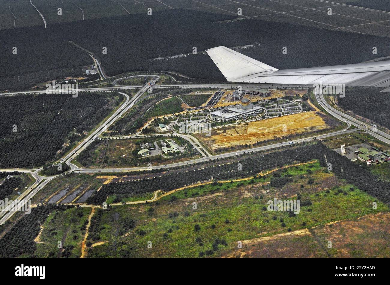 Aerial view, temple complex motorway and forests near Kuala-Lumpur ...