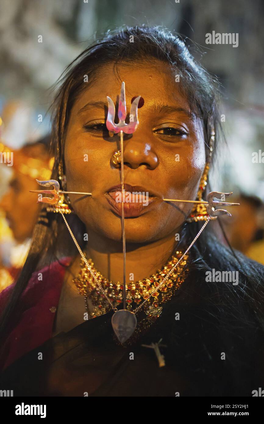 Woman piercing at thaipusam festival, batu caves, kuala, lumpur ...