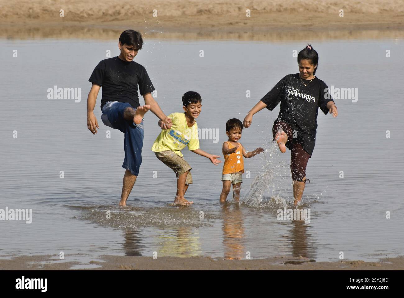 Family enjoying in water at aqsa beach, Malad, Bombay Mumbai ...
