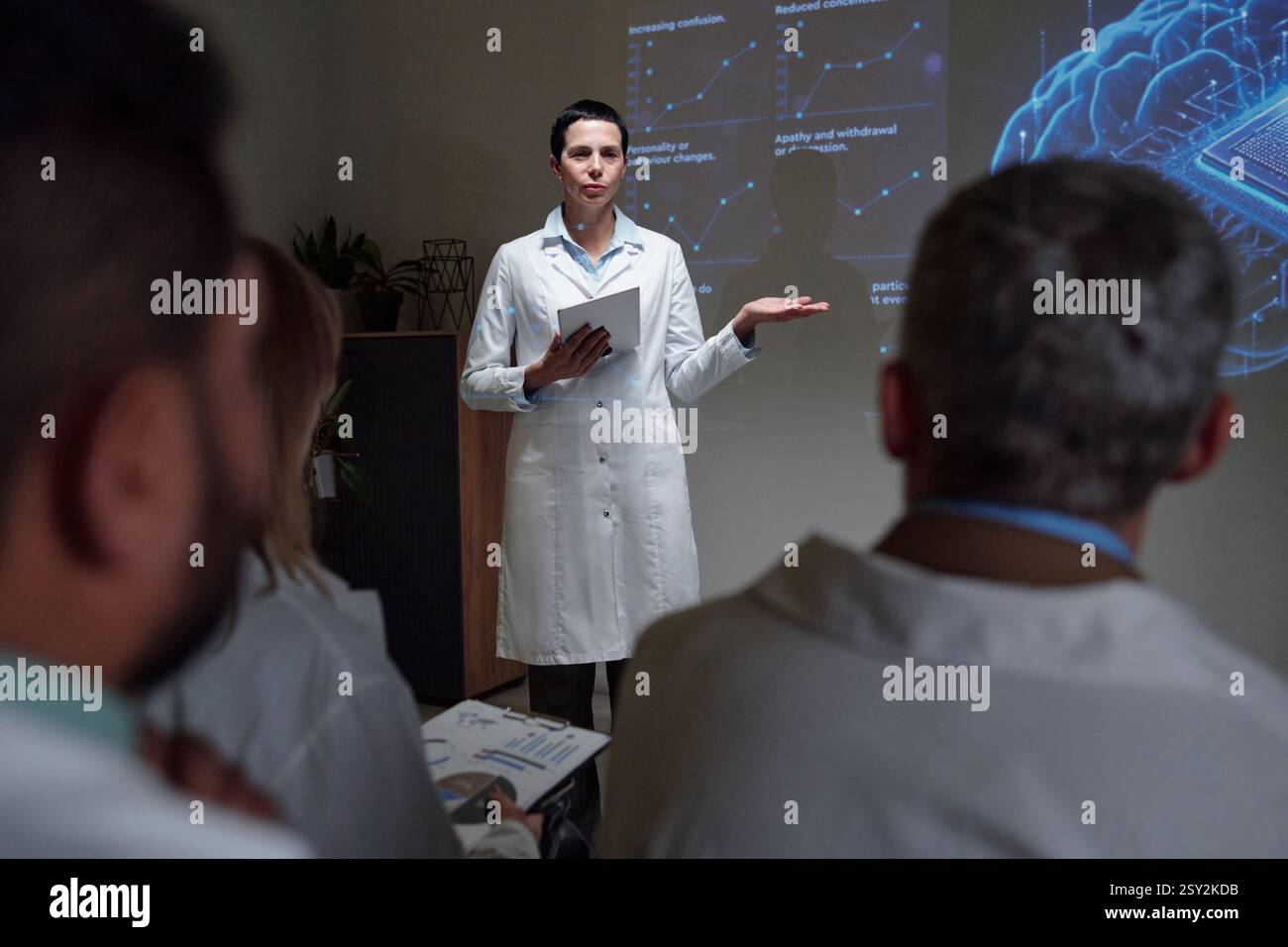 Woman giving presentation screen projection hi-res stock photography ...
