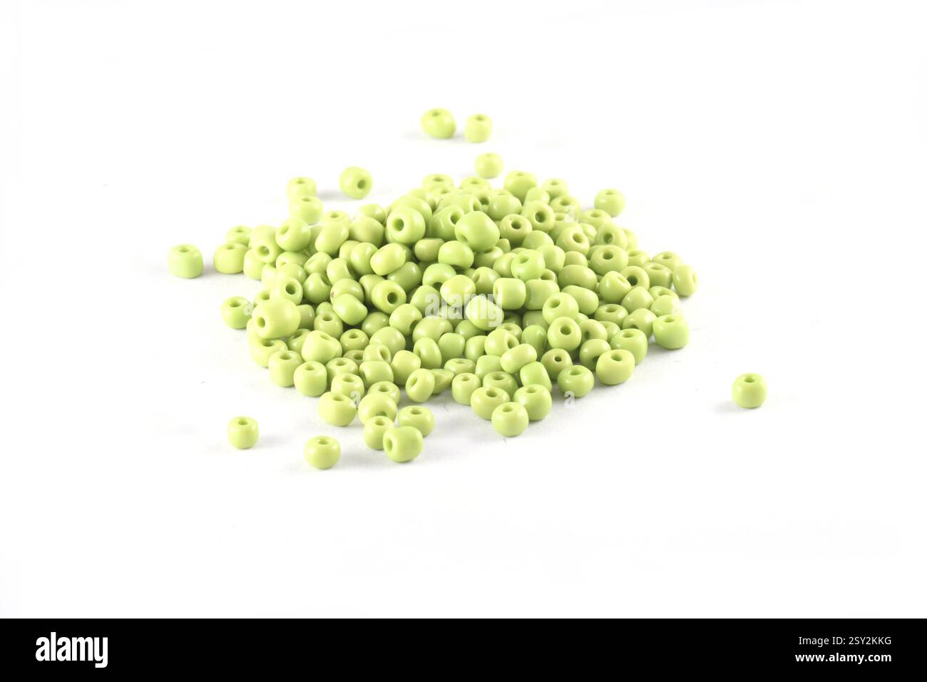 Beads spread on white background. Background or texture of beads. Close ...