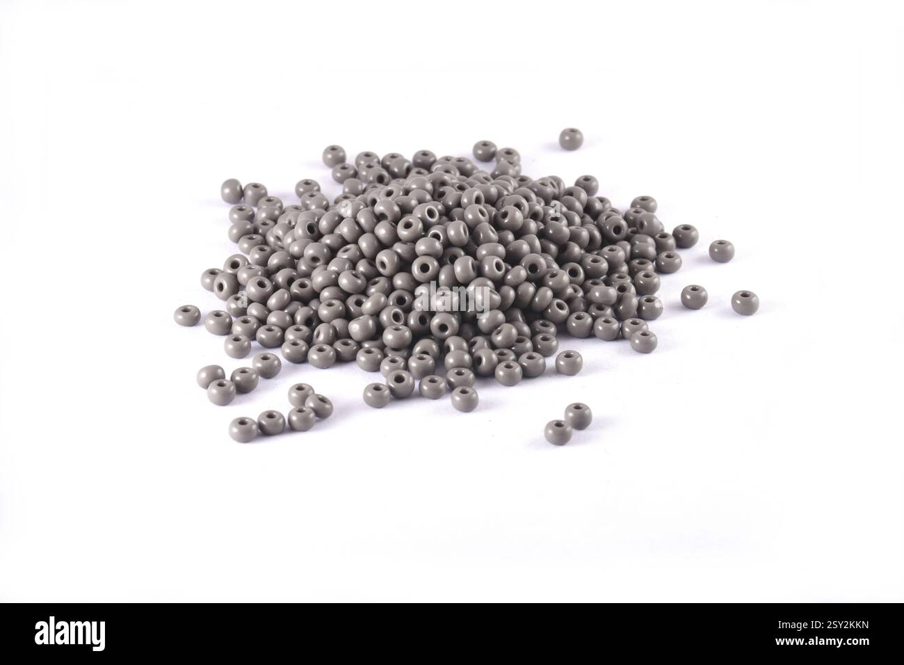 Beads spread on white background. Background or texture of beads. Close ...