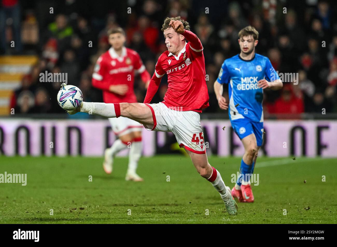 Harry Ashfield of Wrexham controls the ball during the The Vertu Trophy ...