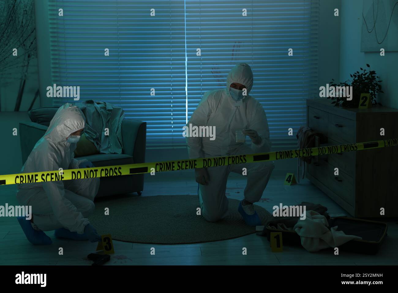 Forensic experts working at crime scene indoors Stock Photo - Alamy