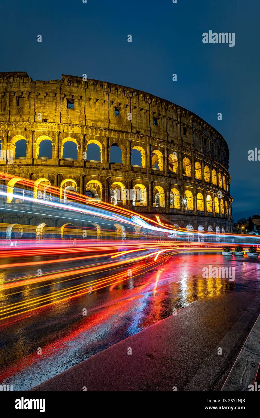 The famous Colosseum with traffic lights running around him. Photo ...