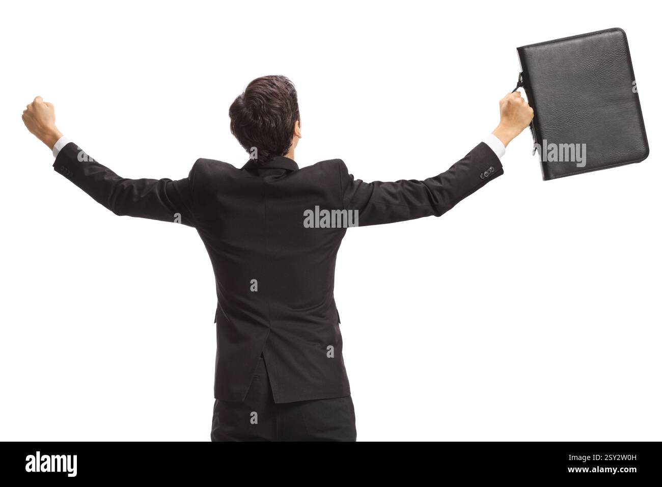 Happy businessman with a briefcase raising hands isolated on white ...