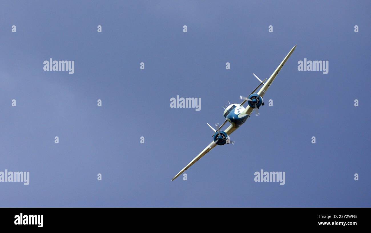Vintage Lockheed 12A Electra Junior in flight Stock Photo - Alamy