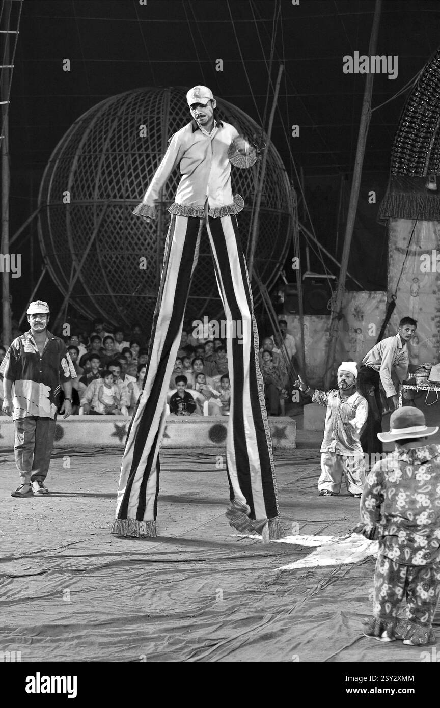Man walking on stilts in circus, india, asia Stock Photo - Alamy