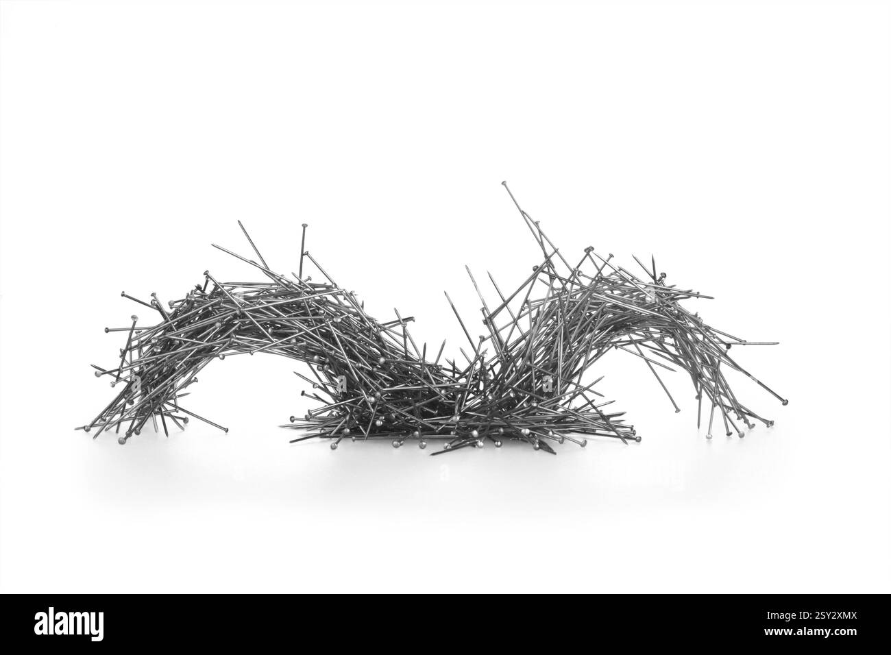 Balancing of pin, expansion shape, india, asia Stock Photo - Alamy