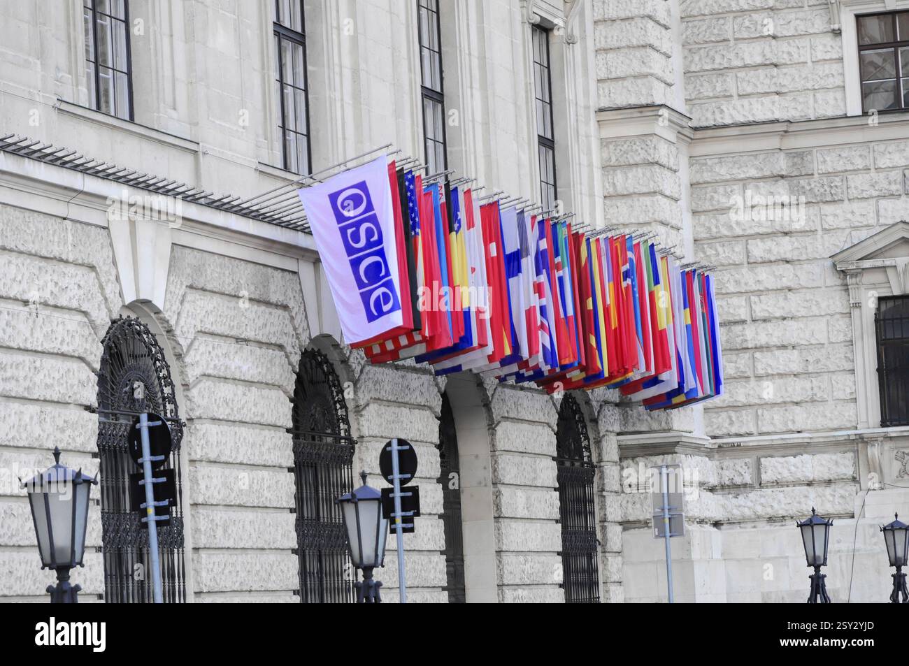 Building with international flags and OSCE sign on the facade, Vienna ...