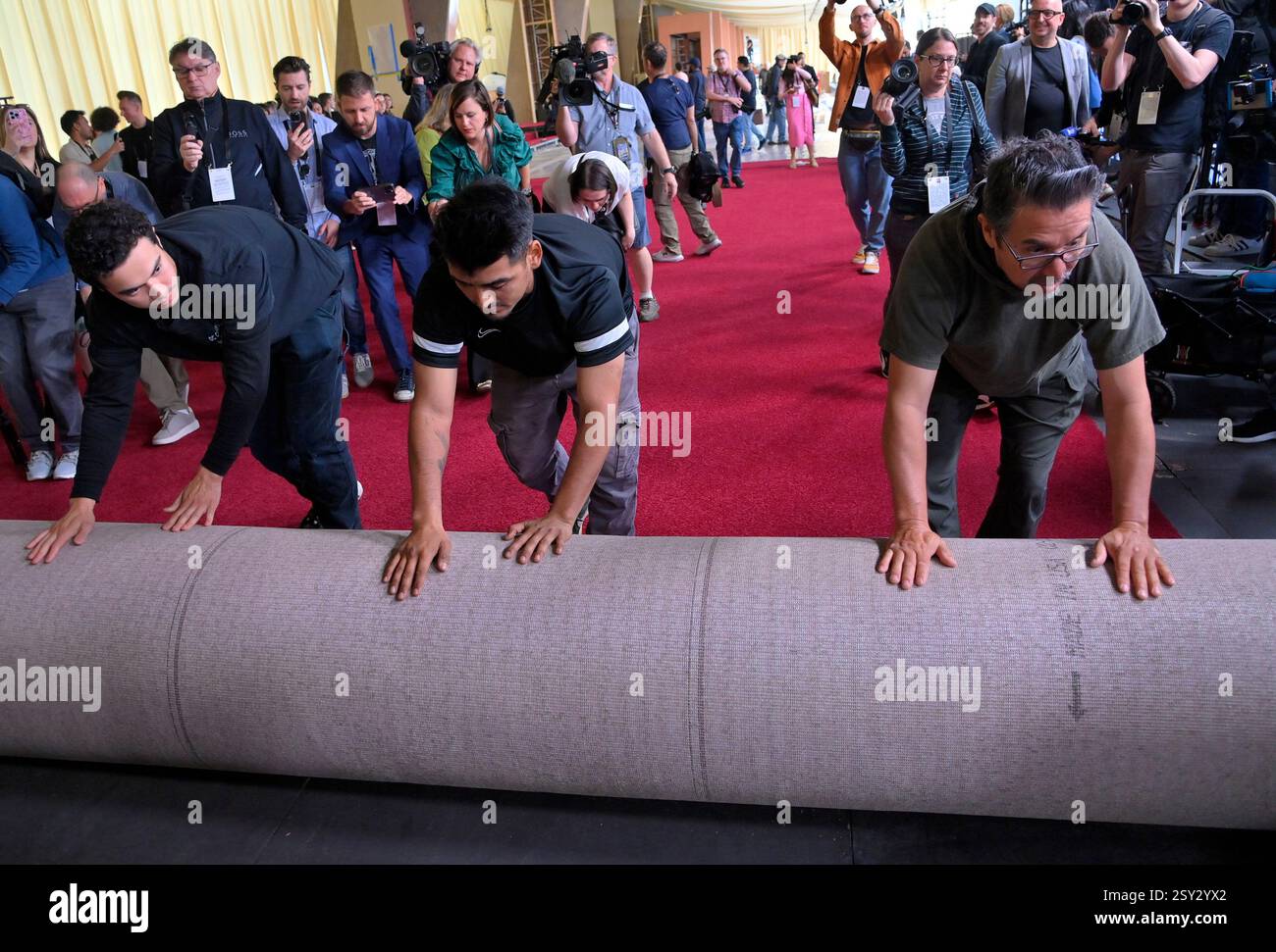 Los Angeles, United States. 26th Feb, 2025. Crew members roll out the ...