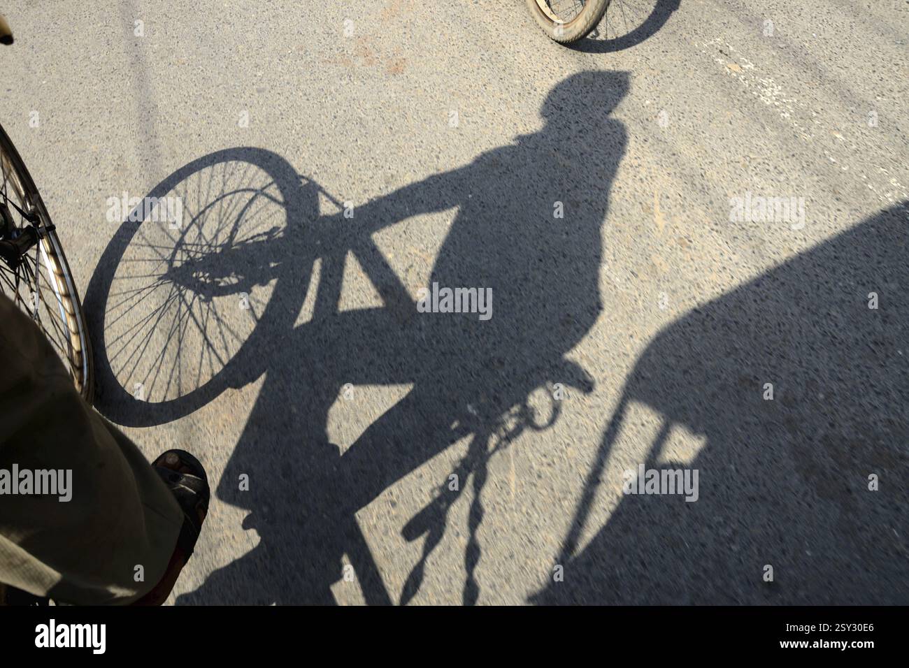 Shadow of rickshaw driver on road, varanasi, uttar pradesh, india, asia ...