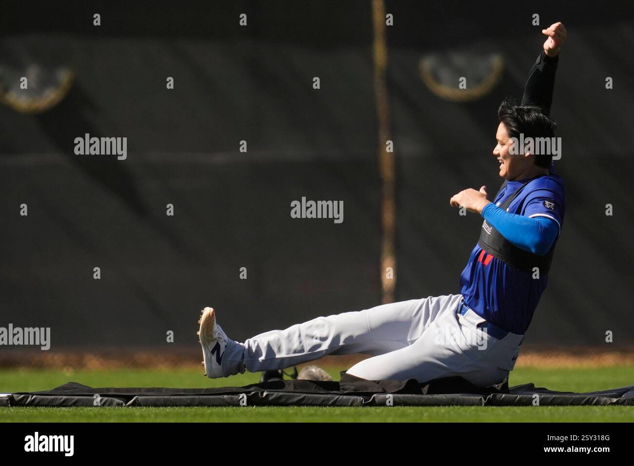 Los Angeles Dodgers two-way player Shohei Ohtani works out during a ...