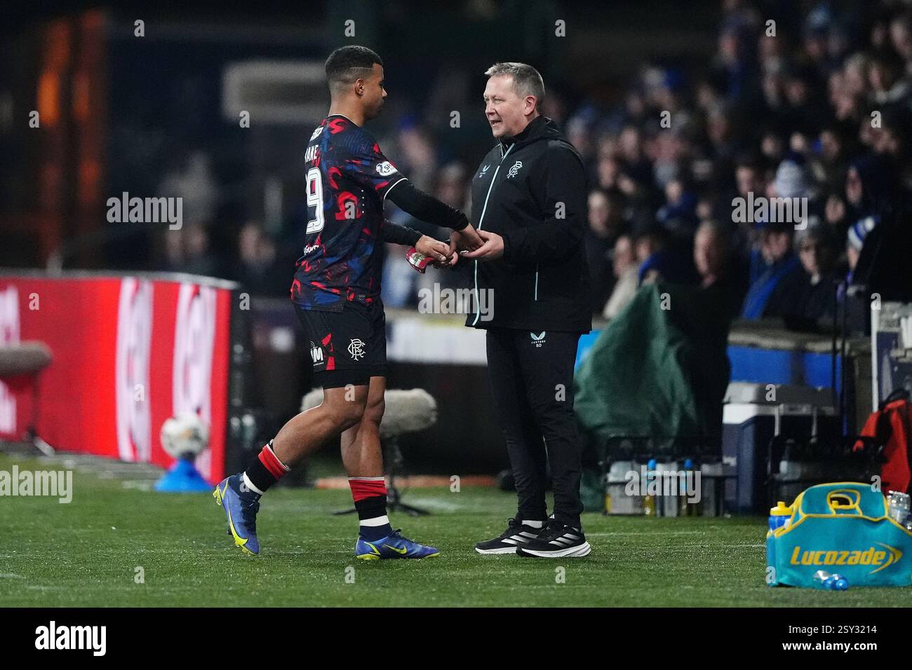 Rangers' Hamza Igamane (left) embraces coach Billy Dodds during the ...